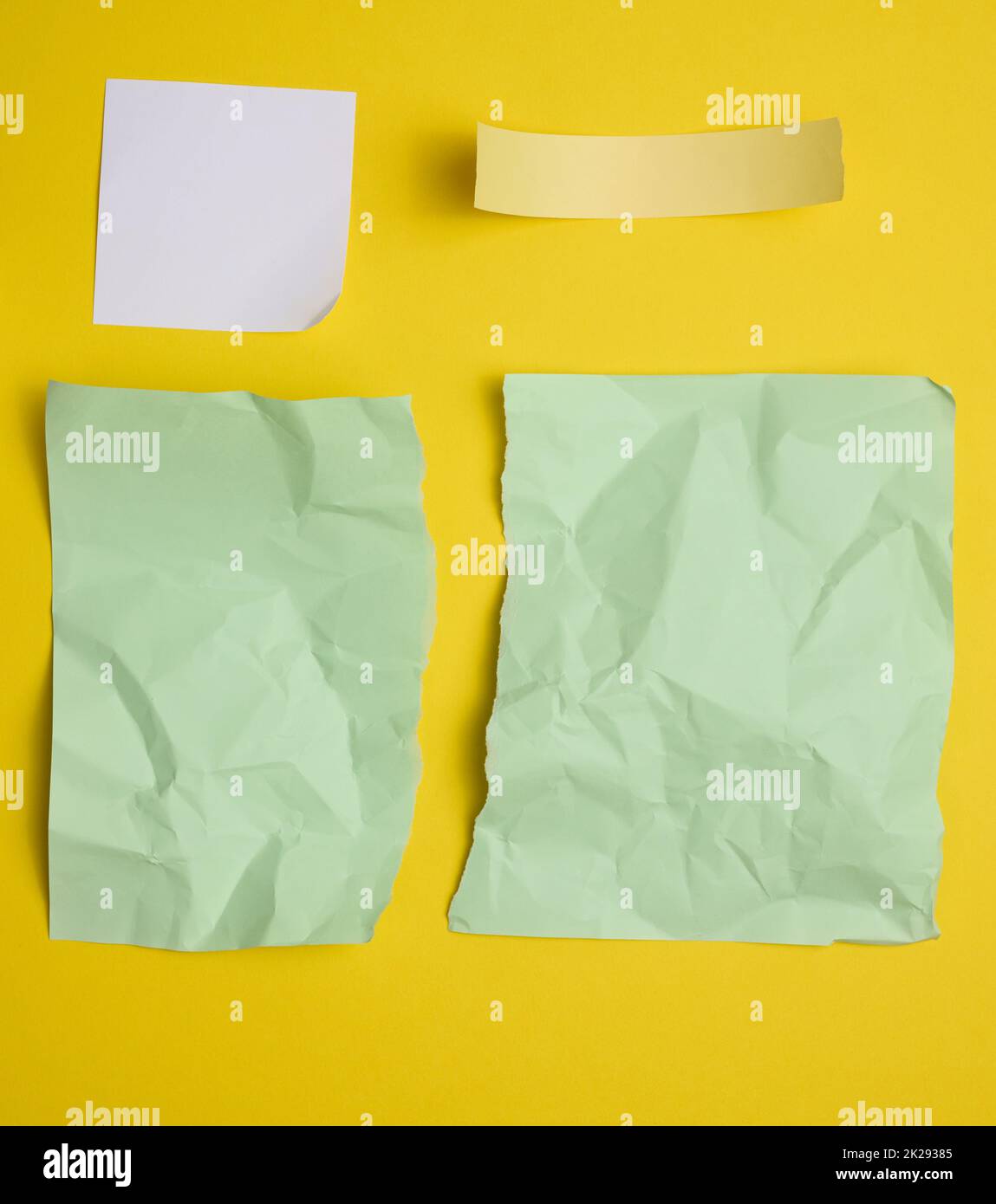 various torn pieces of paper on yellow background Stock Photo - Alamy