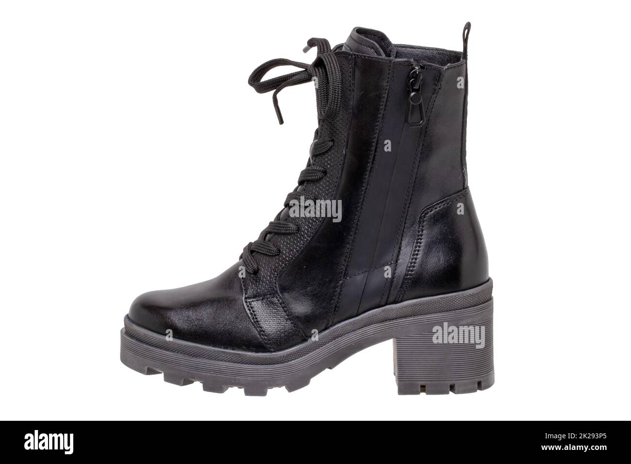 Womens boots and shoes. Closeup of female elegant black leather winter ...