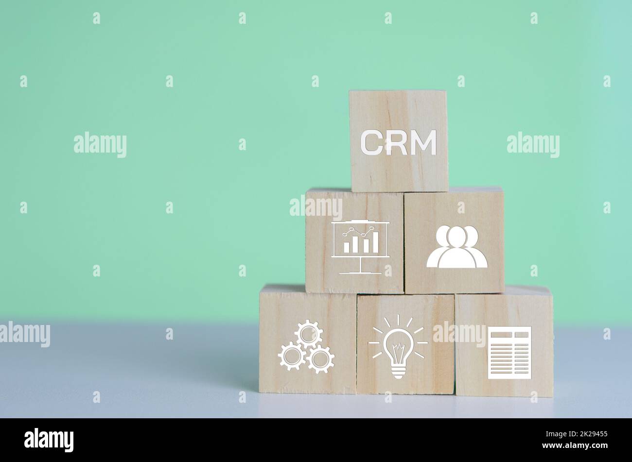 Wooden cubes with CRM Customer relationship management automation ...