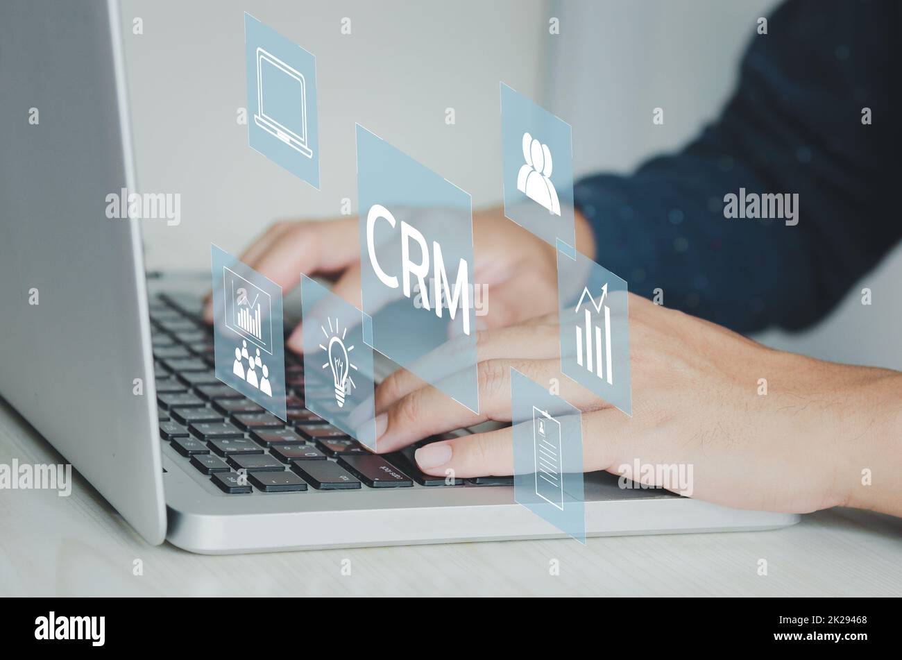 Hand typing on laptop concept. Icons CRM Customer Relationship ...