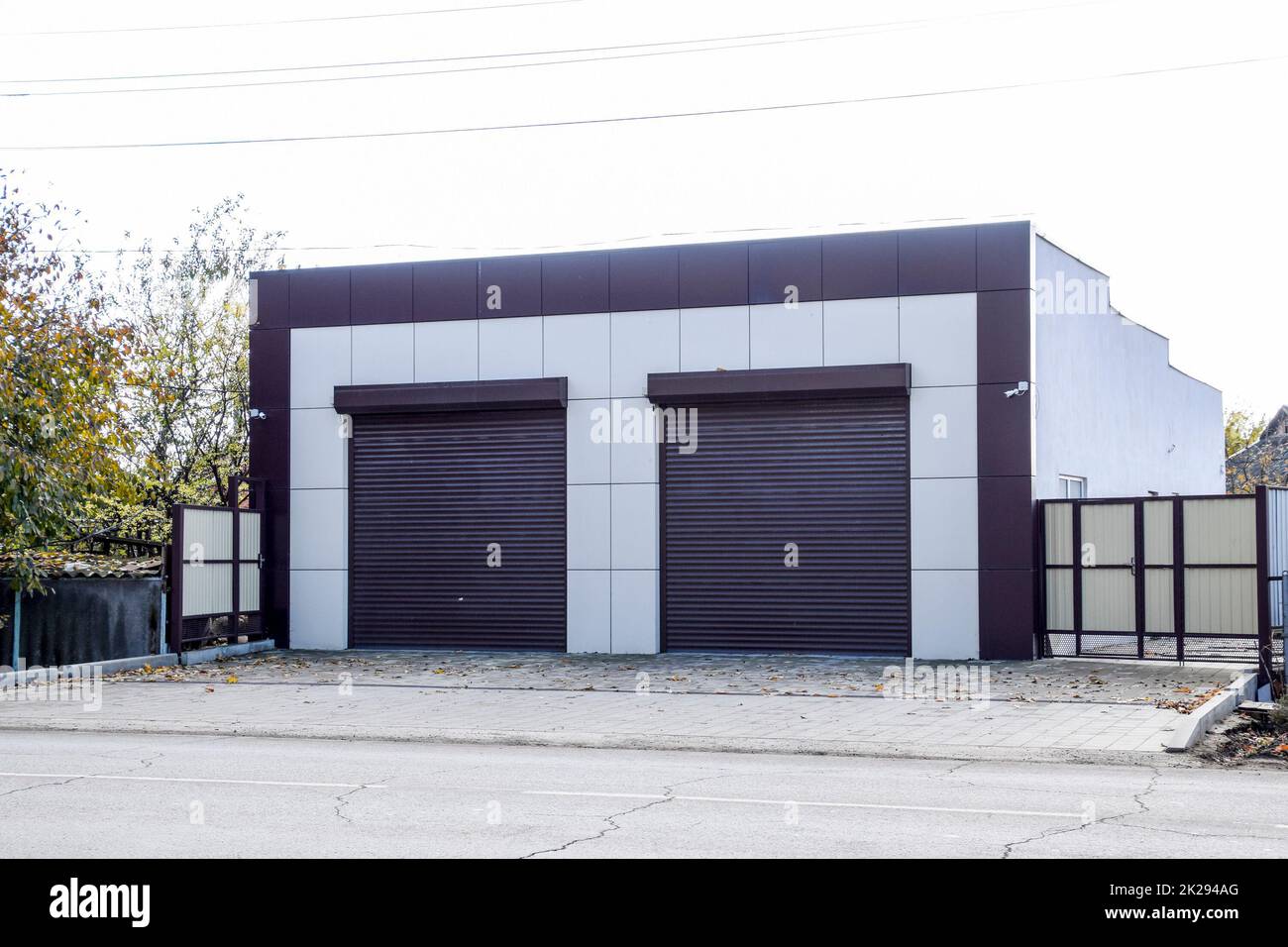 Garage for two cars with roller shutter. Modern gate in the garage with ...