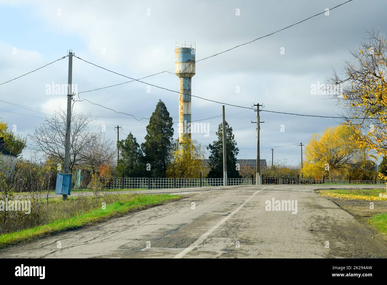 Old water tower in the village. Autumn landscape Stock Photo - Alamy