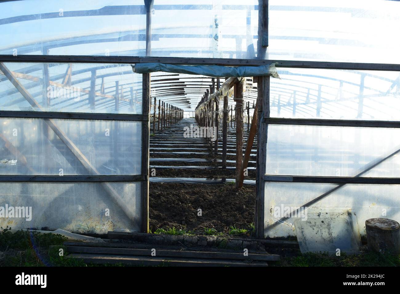 Greenhouses made of polymer film. Early spring in the garden ...
