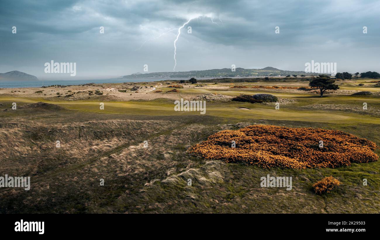 Irish coastline dunes with a moody sky over the beach. Portmarnock ...