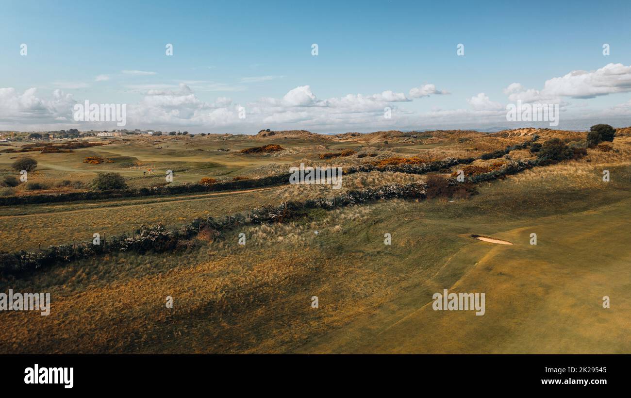 Irish coastline dunes with a moody sky over the beach. Portmarnock ...