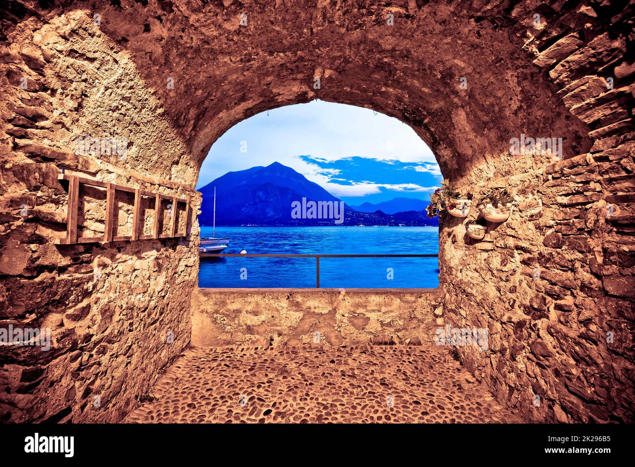 Como lake. Lakefront evening view through stone window in town of ...