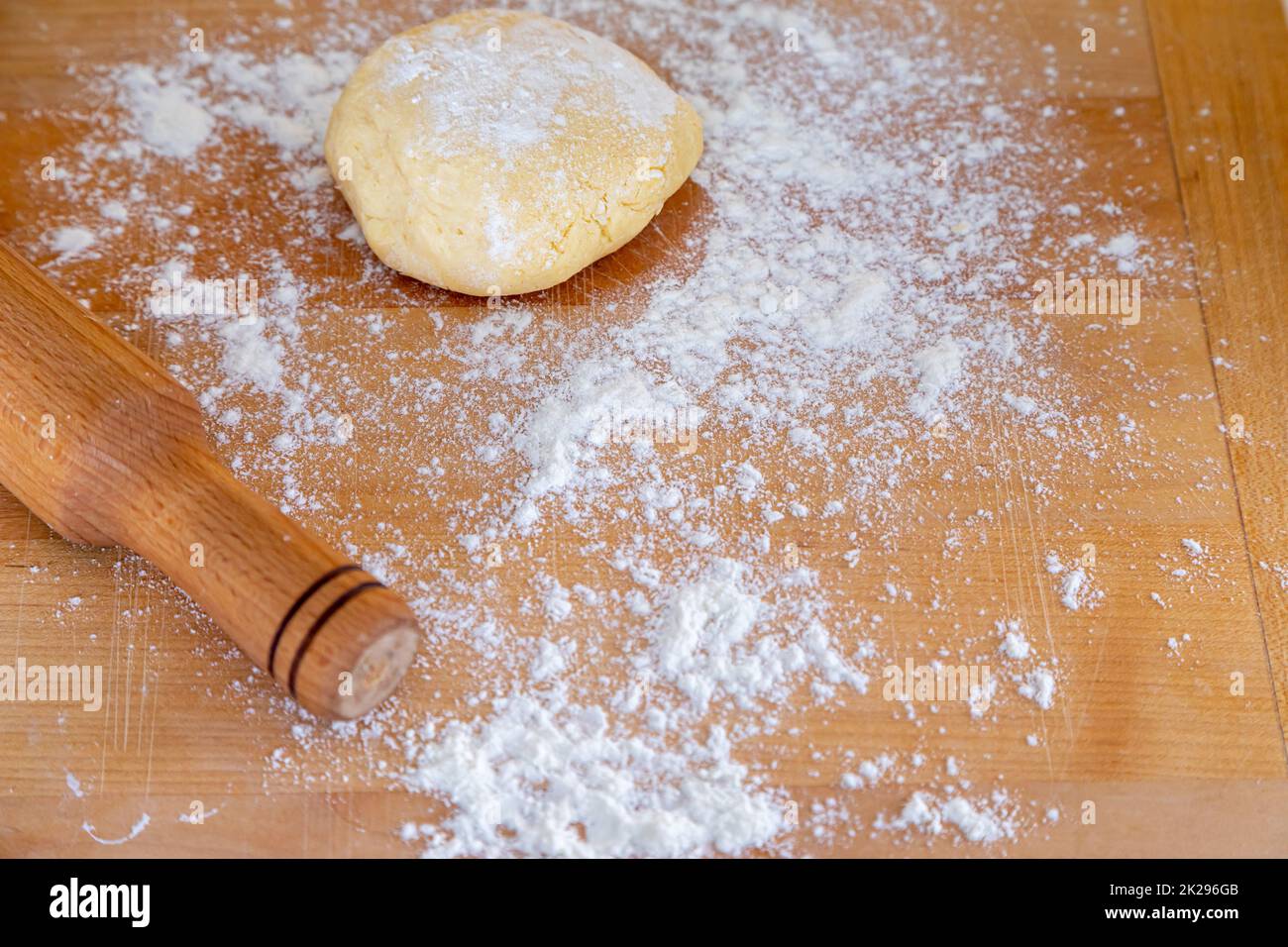 Dough, rolling pin and flour on table, dough kneading with rolling pin ... Dough, rolling pin and flour on table, dough kneading with rolling pin ...