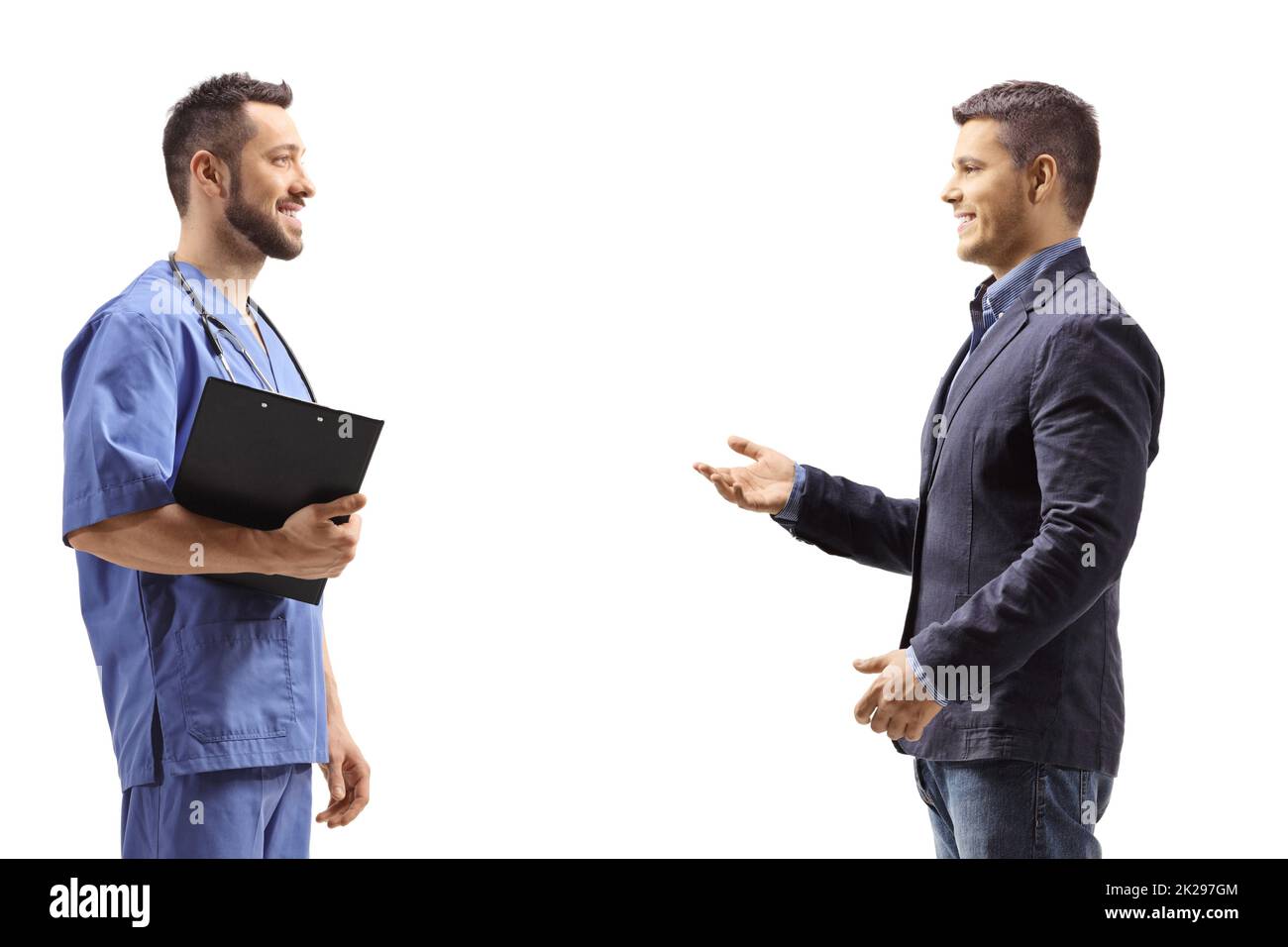 Profile shot of a male healthcare worker listening to a man talking ...
