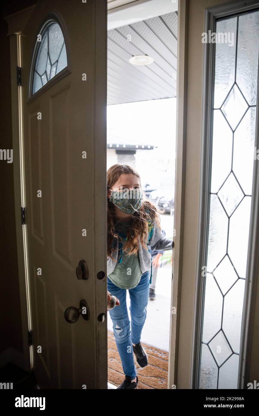 School door girl enter hi-res stock photography and images - Alamy