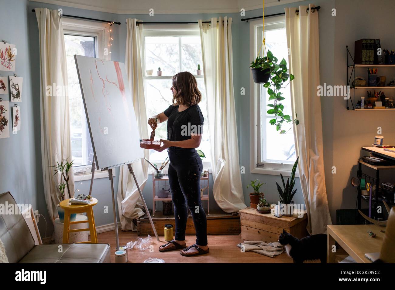 Artist starting work on large painting Stock Photo - Alamy