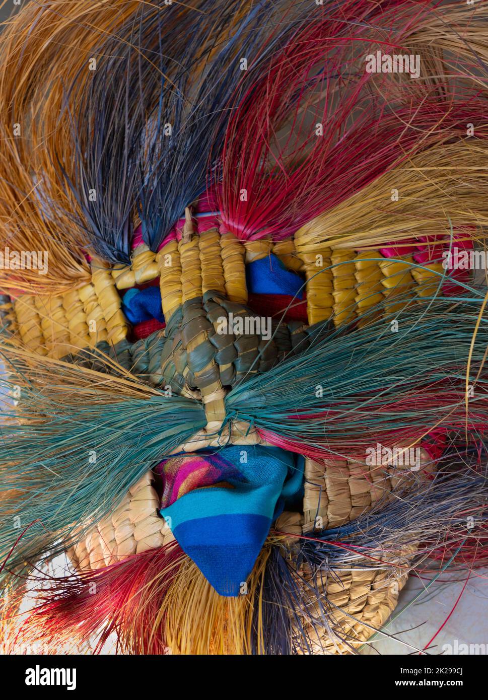 Straw mask is combined with fabrics to make blue red eyes and tongue ...