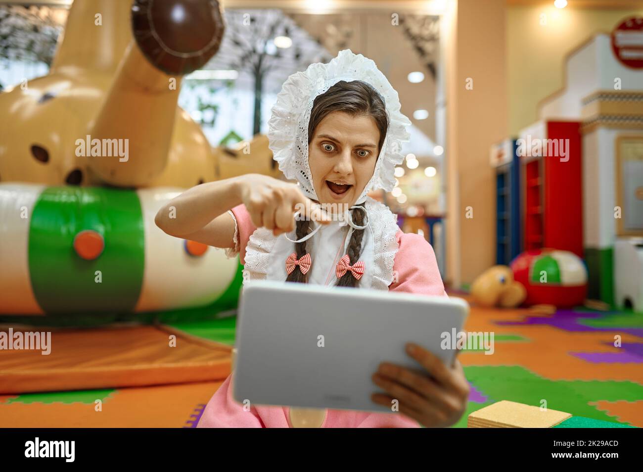 Funny woman little baby playing with digital tablet Stock Photo - Alamy