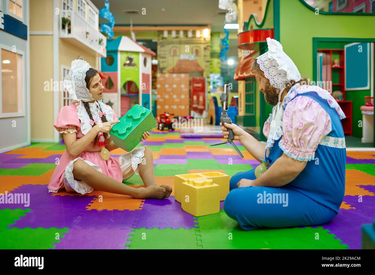 Cute man and woman like babies streaming online video Stock Photo - Alamy