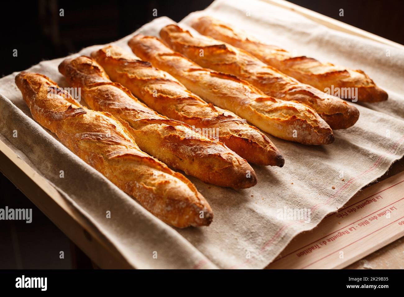 Organic baguettes in authentic bakery setting Stock Photo - Alamy