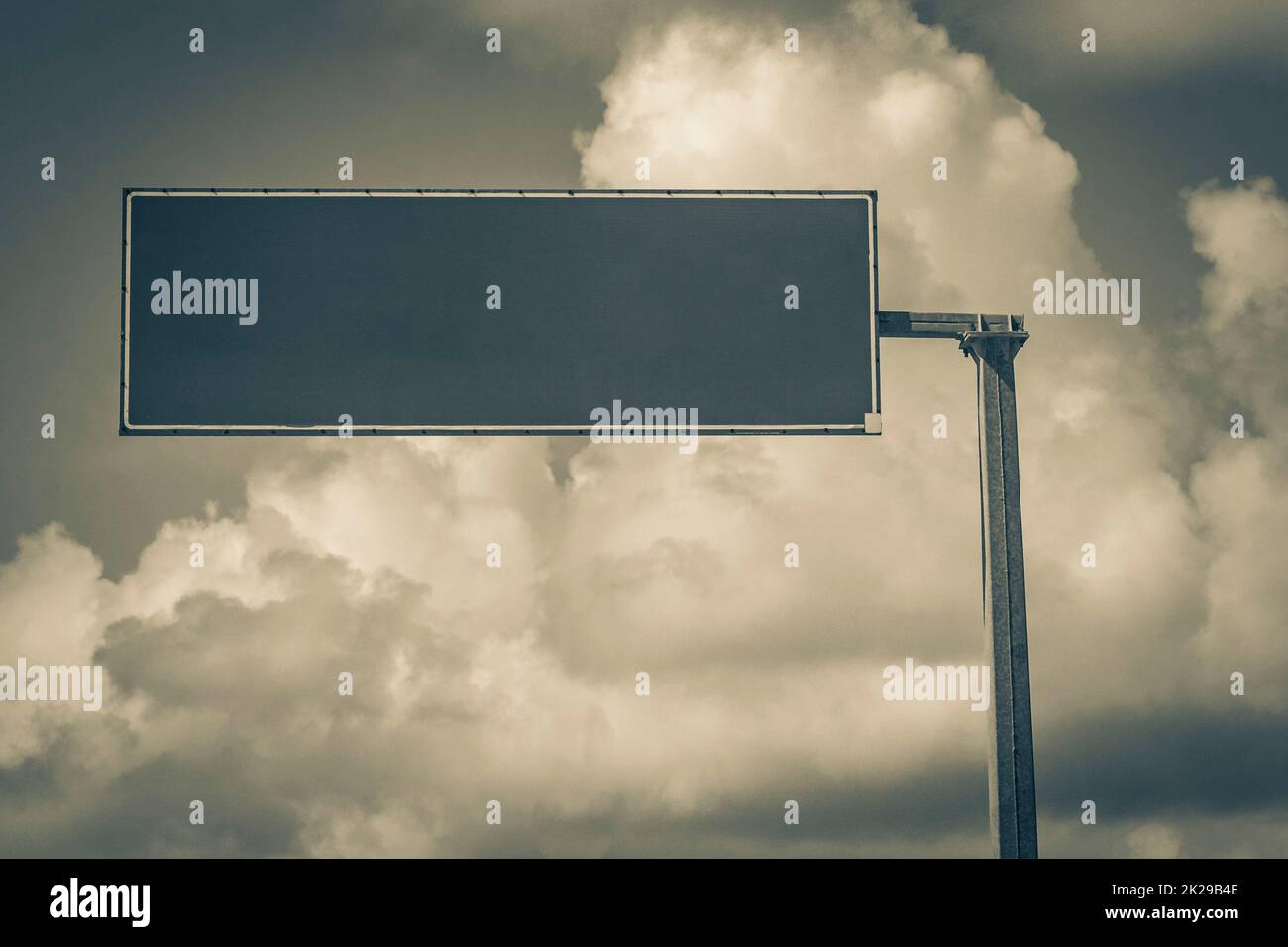 Directional green blank empty road sign in Tulum Mexico Stock Photo - Alamy