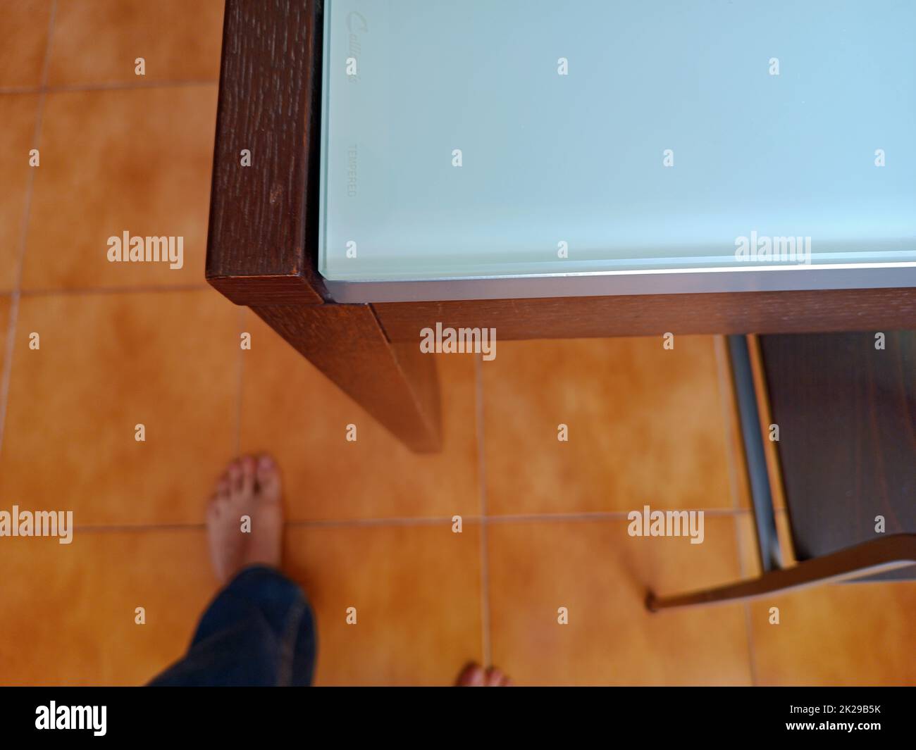 Man barefoot feet table hi-res stock photography and images - Alamy