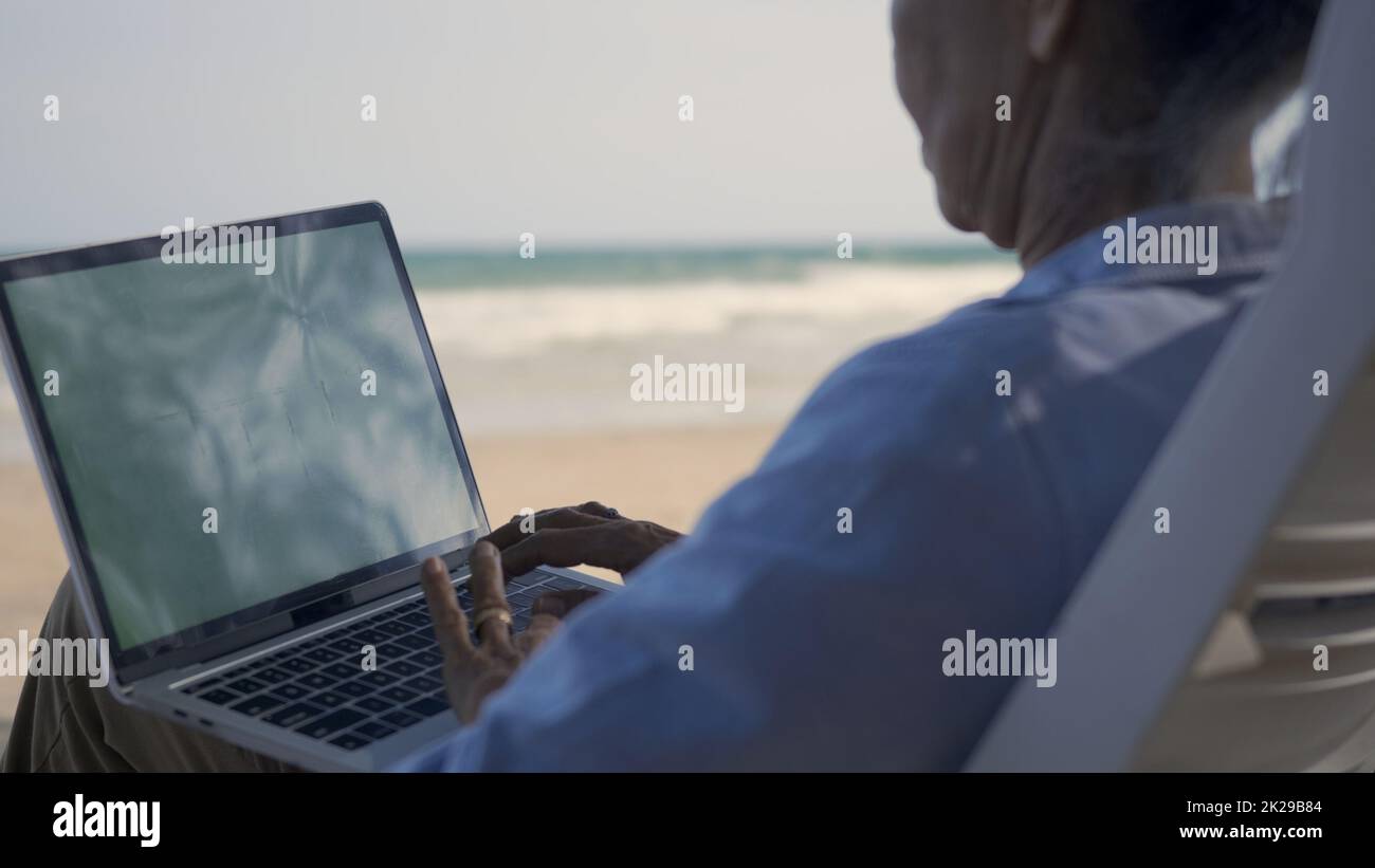 Senior woman relax sitting on chairs enjoying time on beach travel ...