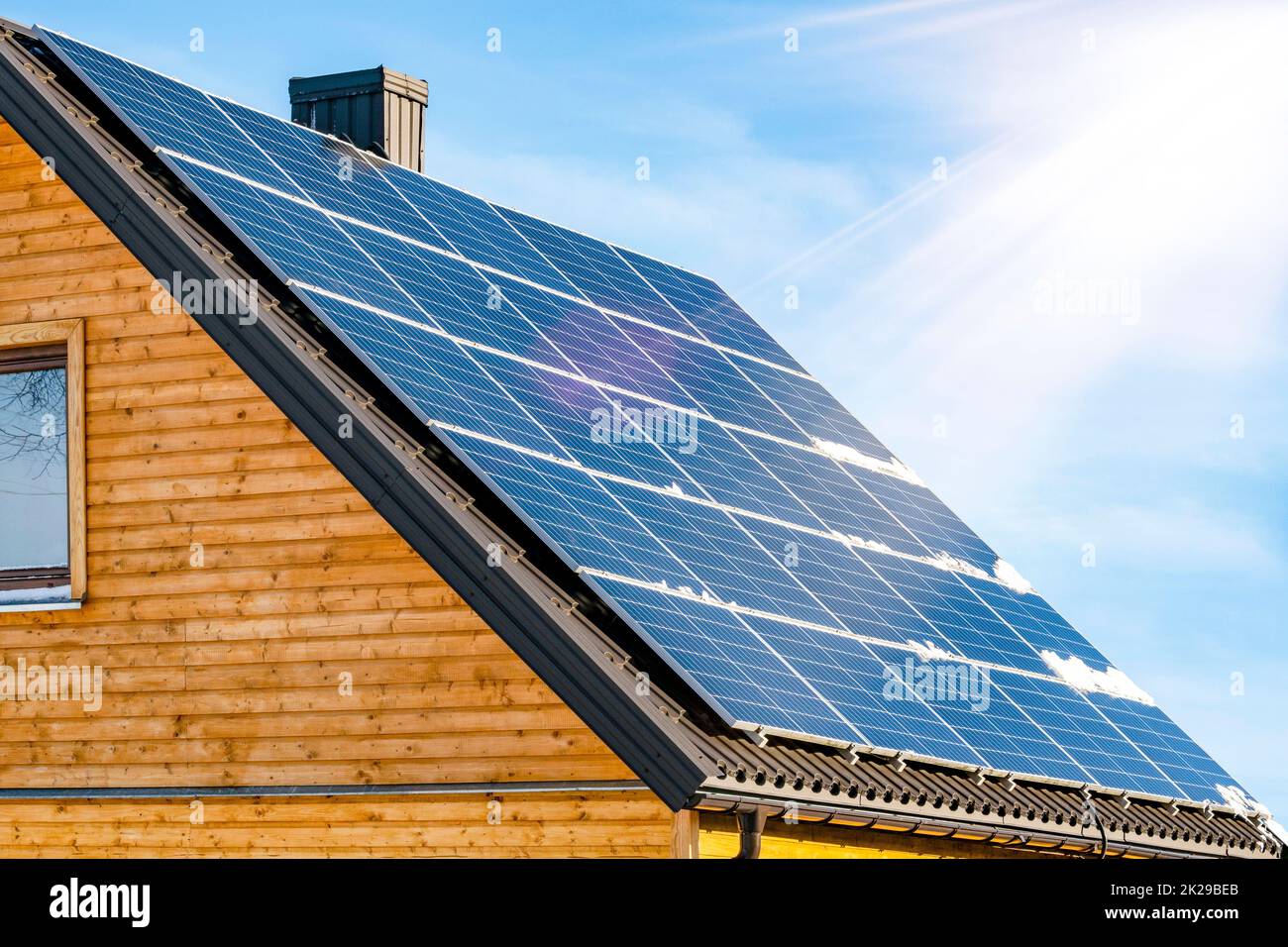 Photovoltaic panels on the house roof Stock Photo - Alamy