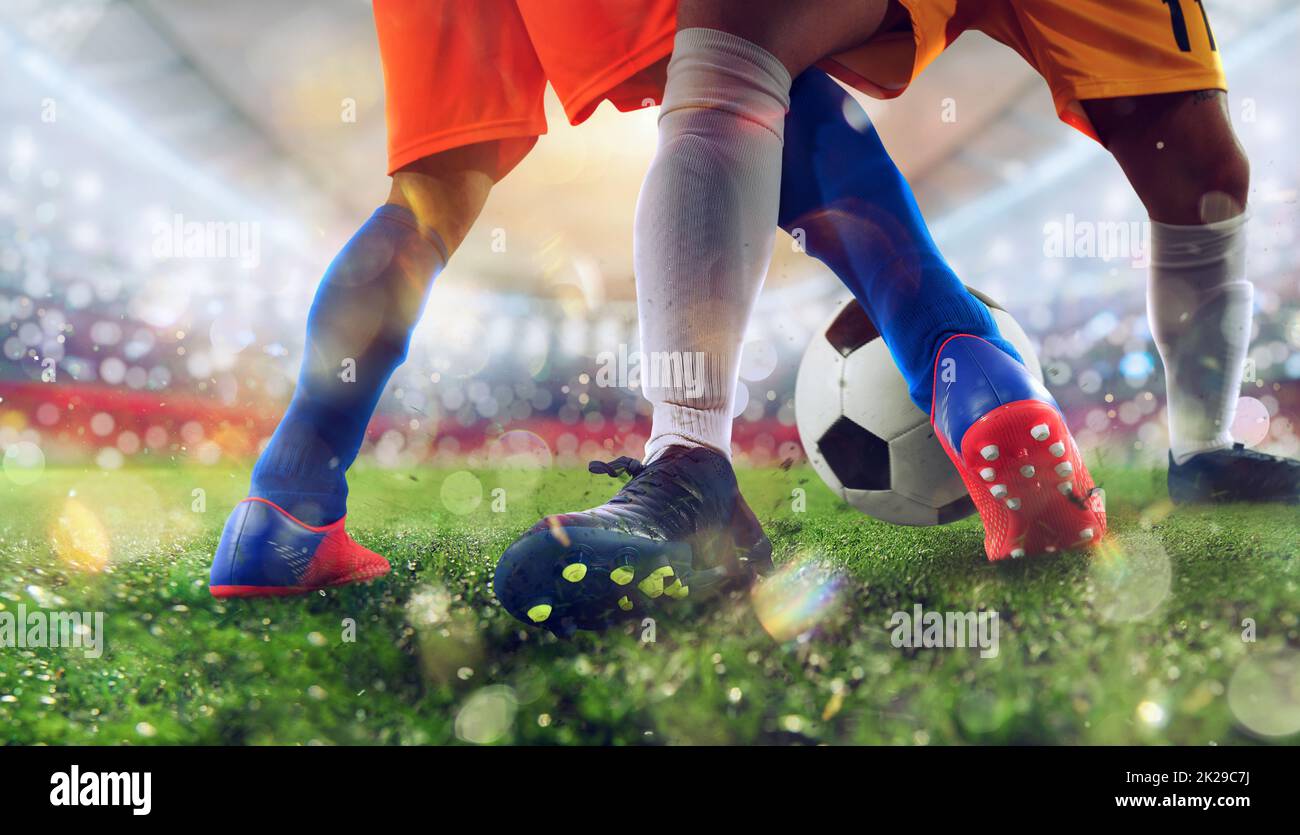 Football scene with competing football players at the stadium Stock ...