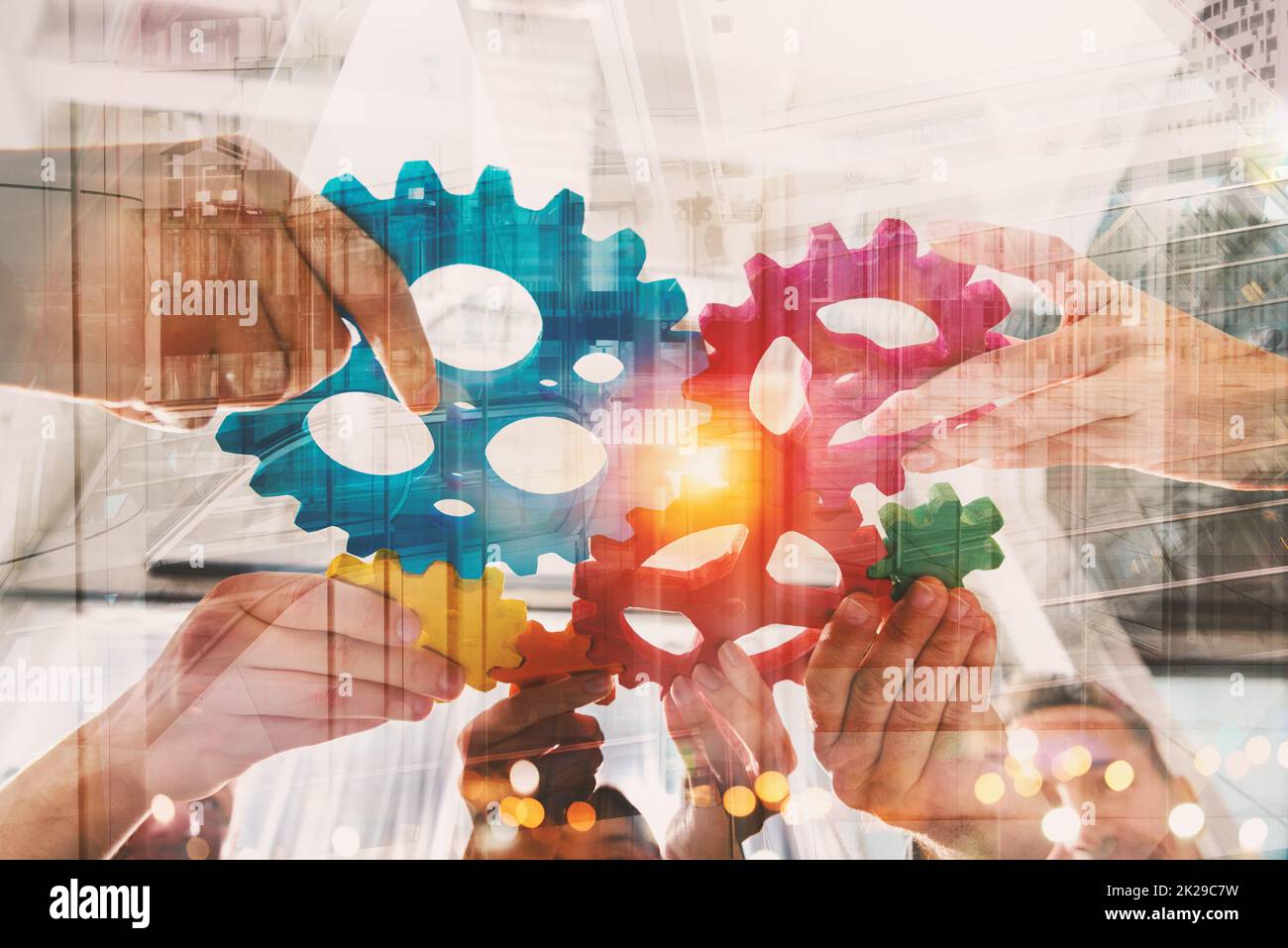 Business team connect pieces of gears like a teamwork and partners ...