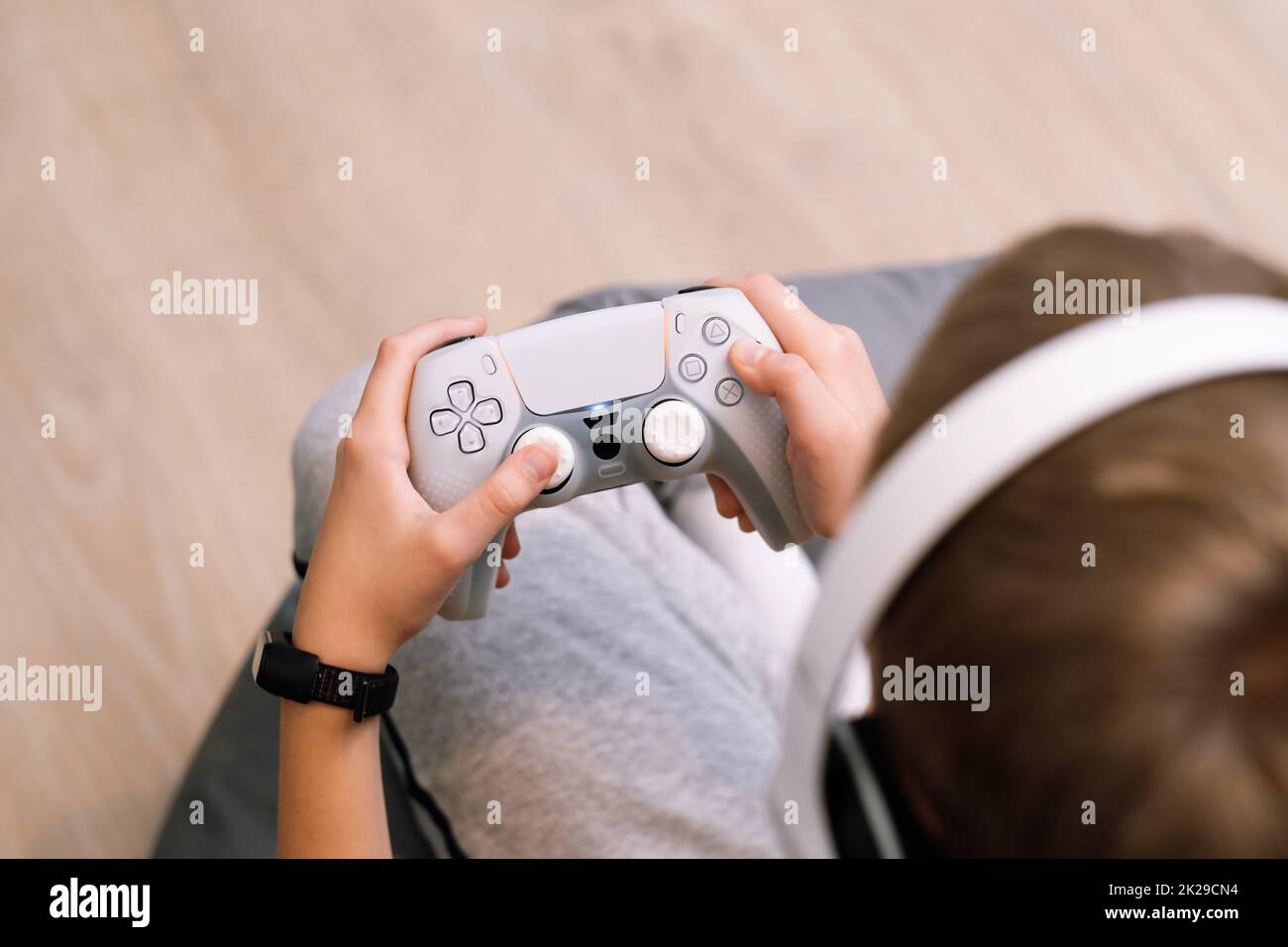 Close-up of teenager boy's hands holding joystick. Concept of playing ...