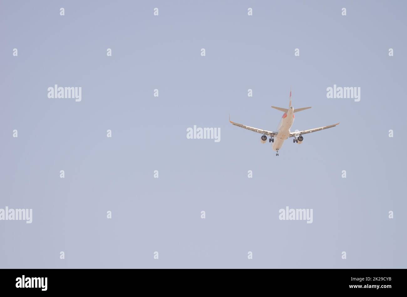 Underside view of an airplane in flight Stock Photo - Alamy