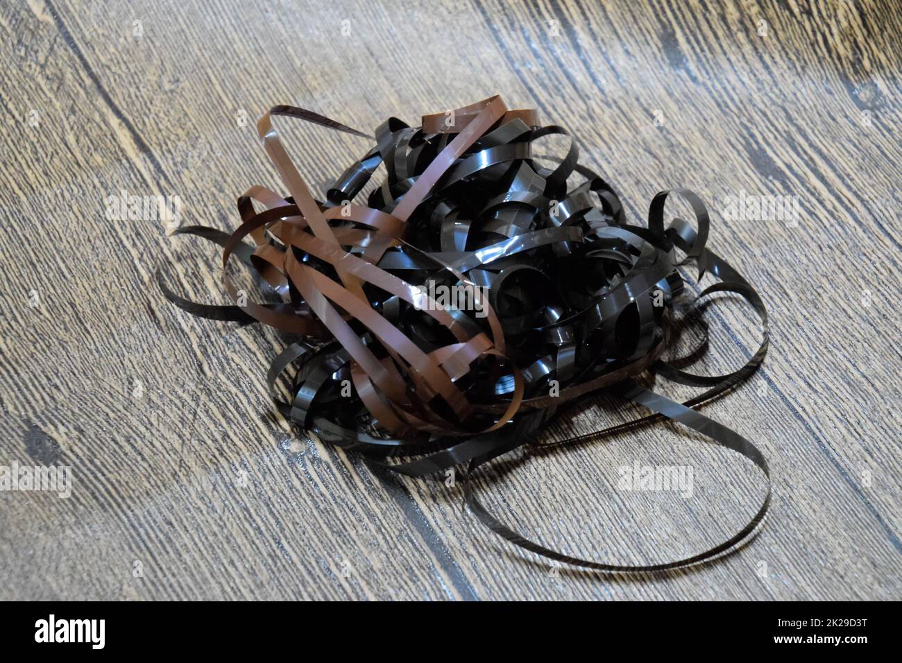 Audio film on the table. A magnetic film pulled out of a broken ...