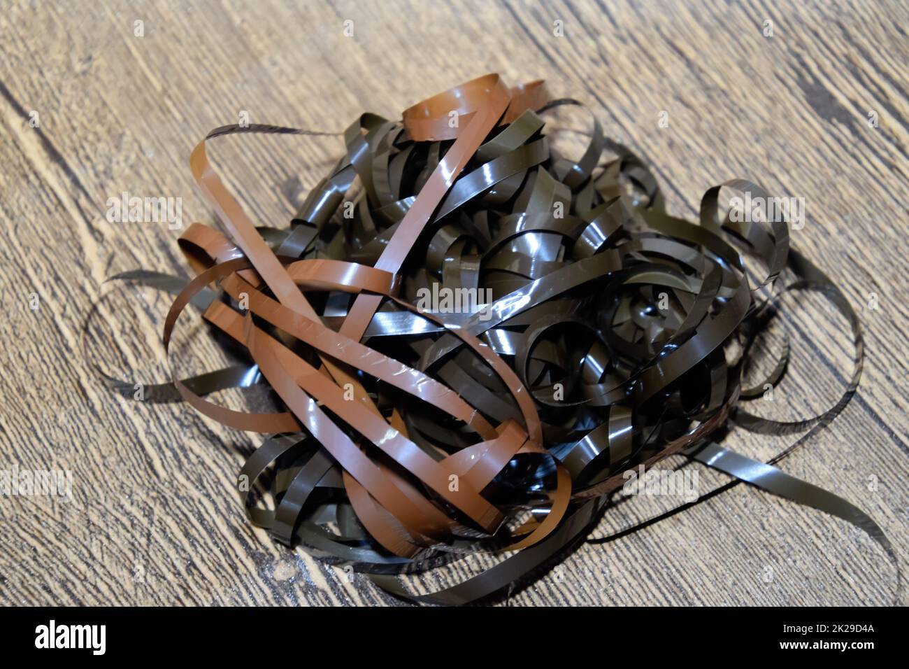 Audio film on the table. A magnetic film pulled out of a broken ...