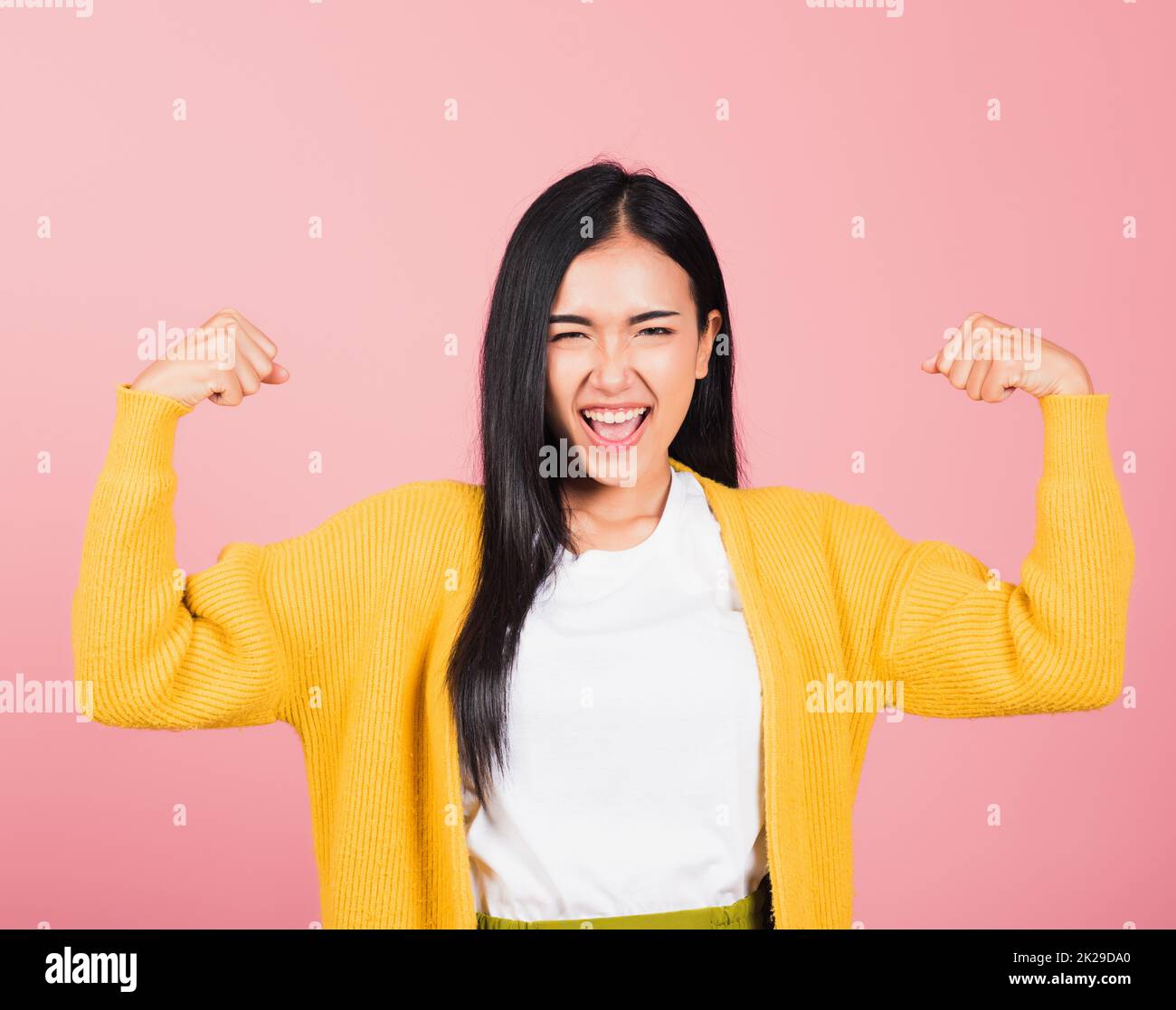 Woman showing arm muscle hi-res stock photography and images - Alamy