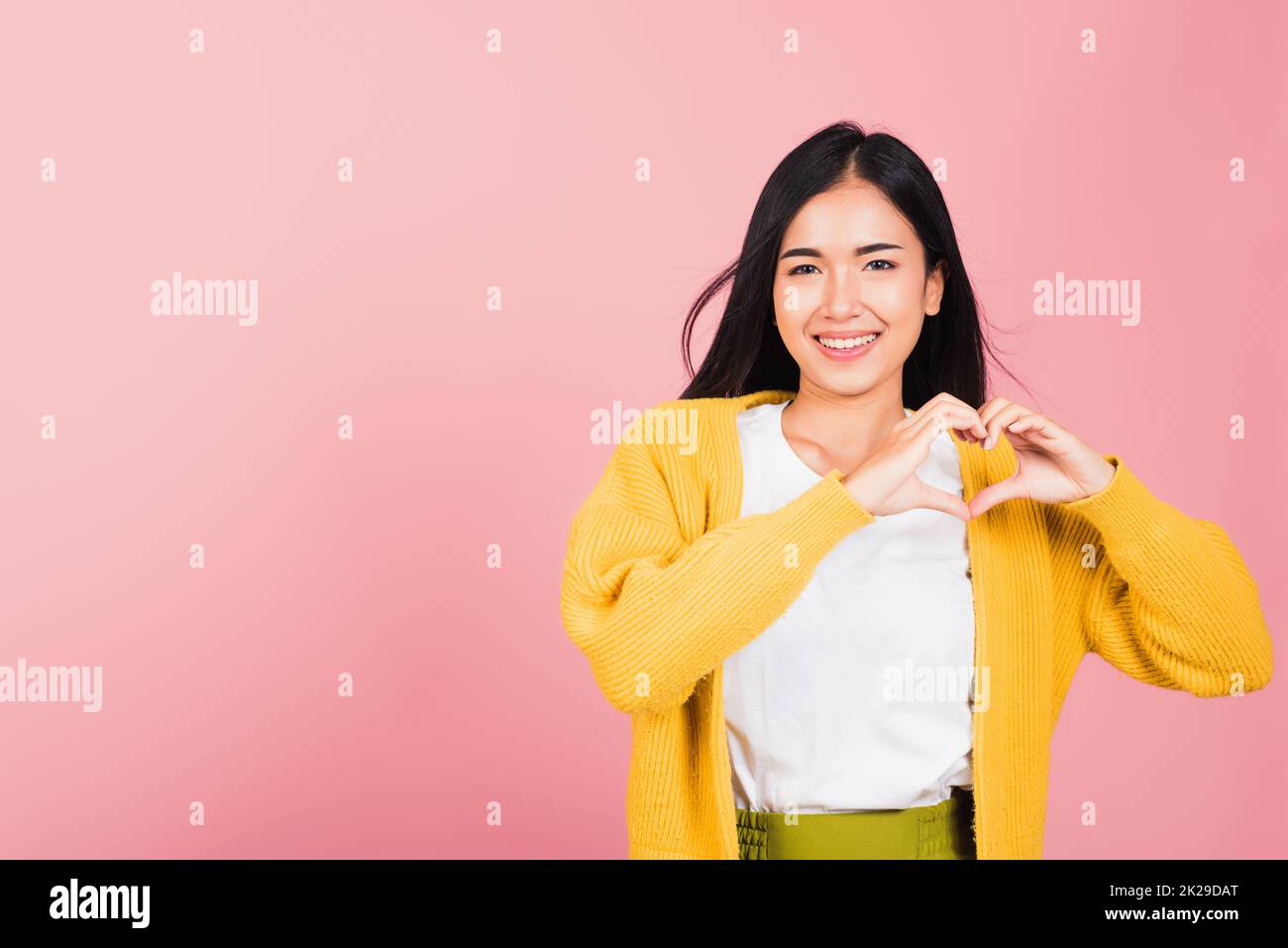 woman smile make finger heart gesture figure symbol shape sign Stock ...