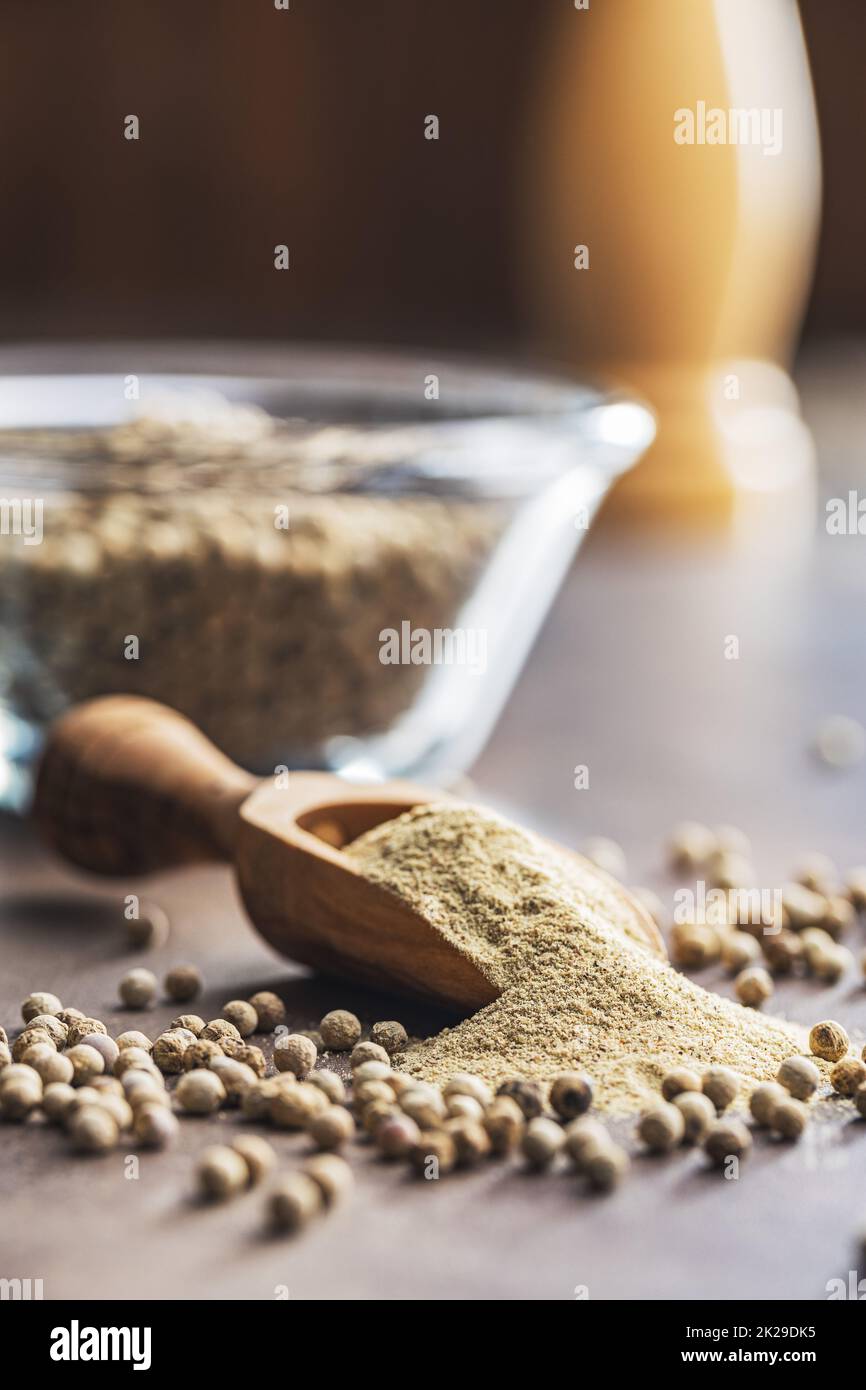 White ground pepper and whole peppercorn spice in wooden scoop Stock ...