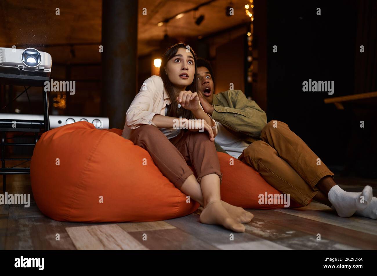 Frightened couple watching horror hi-res stock photography and images ...