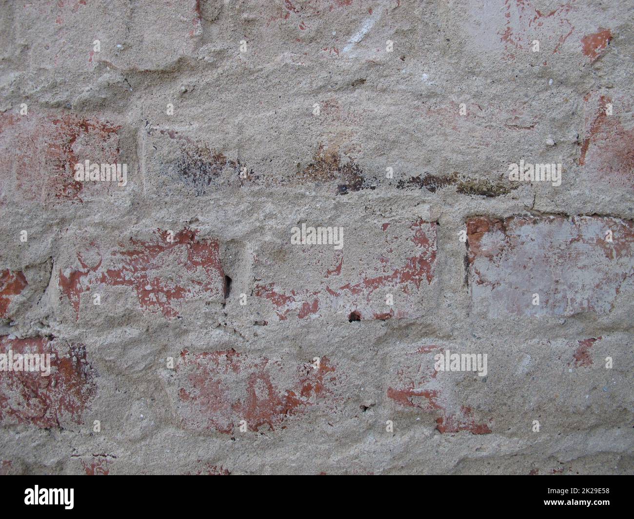 Brick masonry freed from plaster, unplastered house brick wall without ...