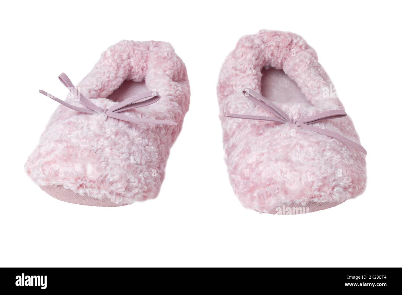 Slippers isolated. Close-up of a pair of female pink warm and soft cosy ...