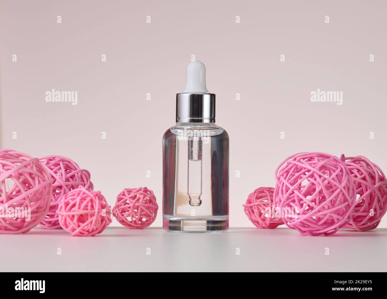 glass transparent white bottle with a pipette. Container for cosmetics ...