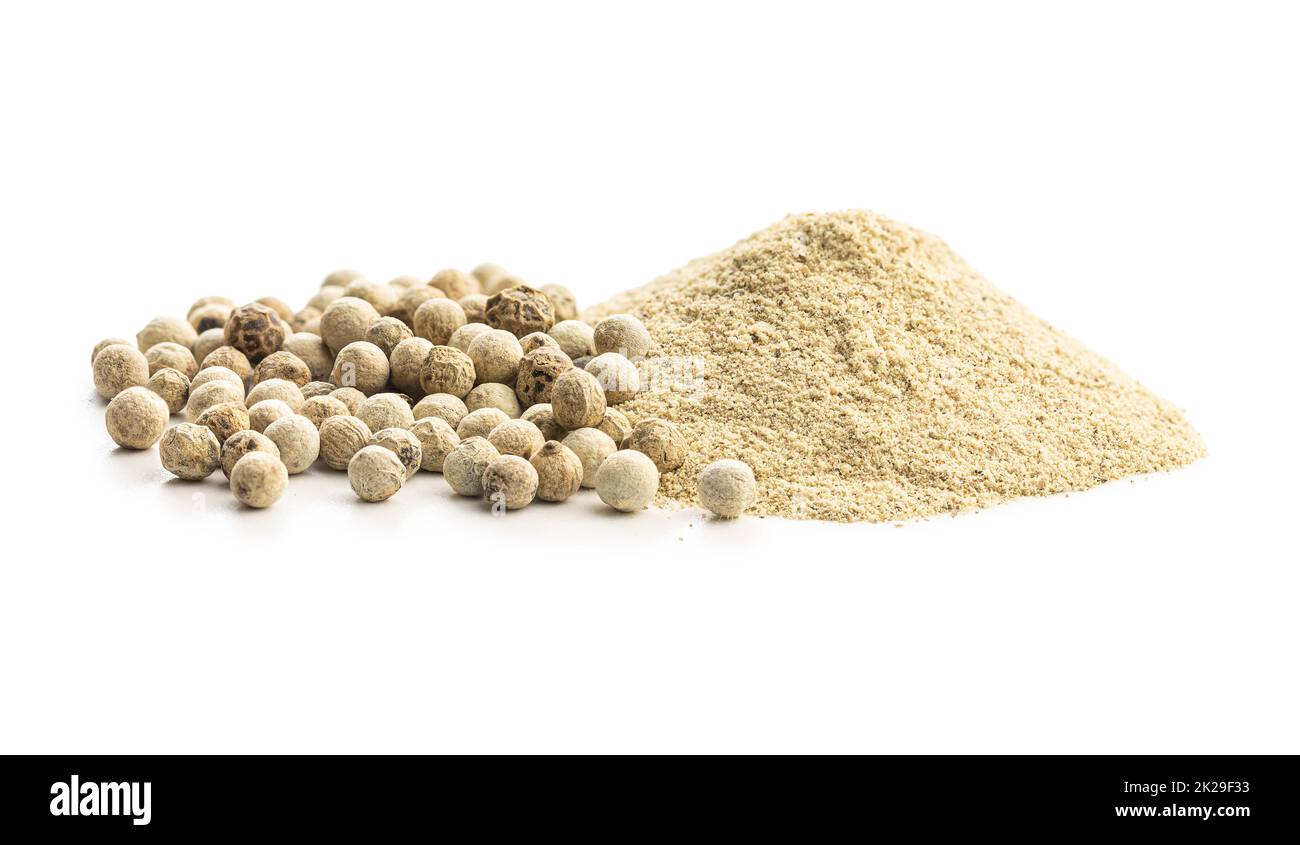 White ground pepper and whole peppercorn spice isolated on white ...
