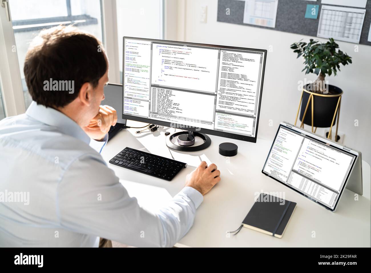 Computer Programmer Writing Program Code On Computer Stock Photo - Alamy