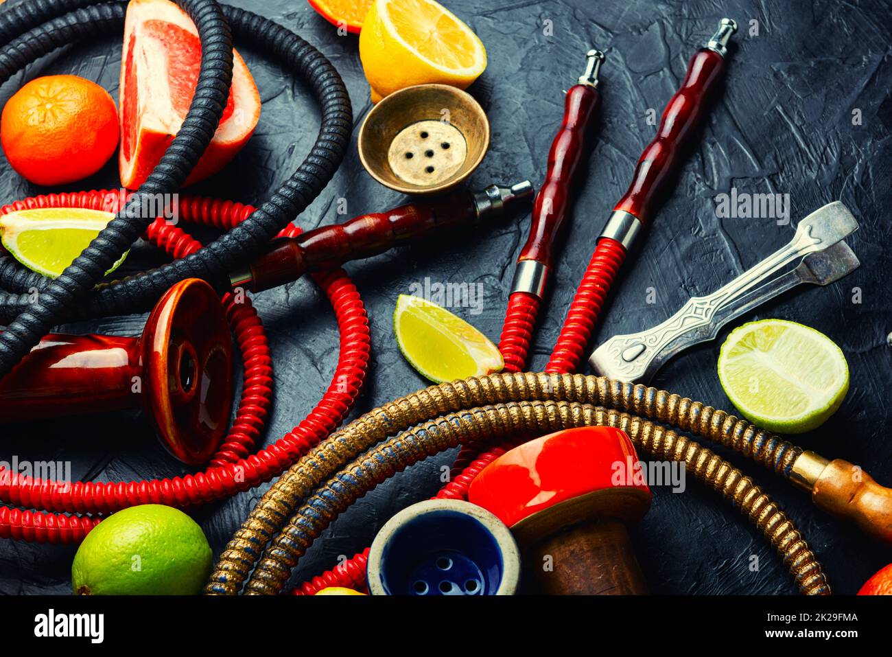 Smoking shisha with citrus fruits Stock Photo - Alamy