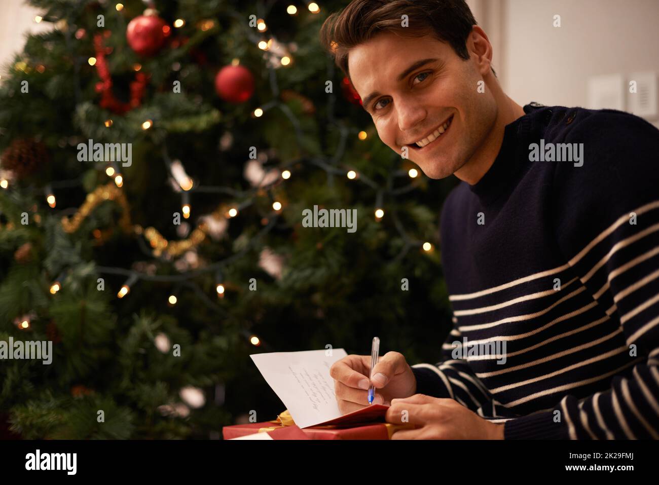 Happy to be spreading the joy. a handsome young man getting ready for ...