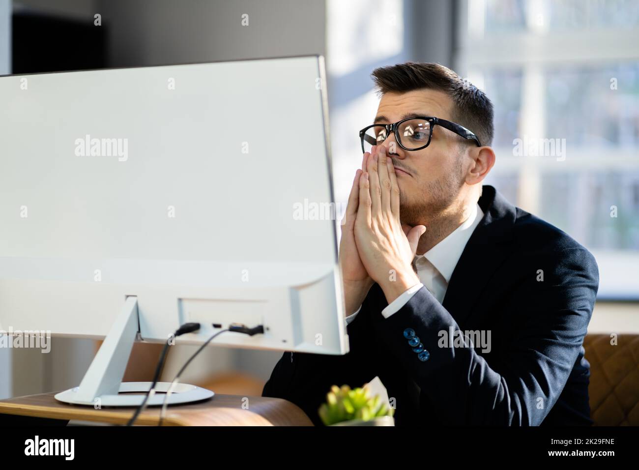 Pondering Thinking Businessman Using Office Computer Stock Photo - Alamy