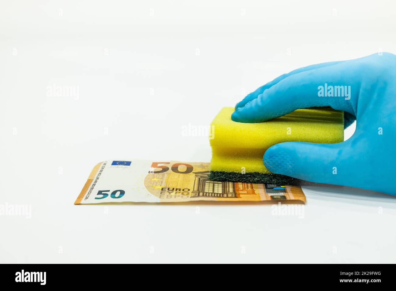 50 Euro money banknote, gloves, and sponge. The concept of money ...