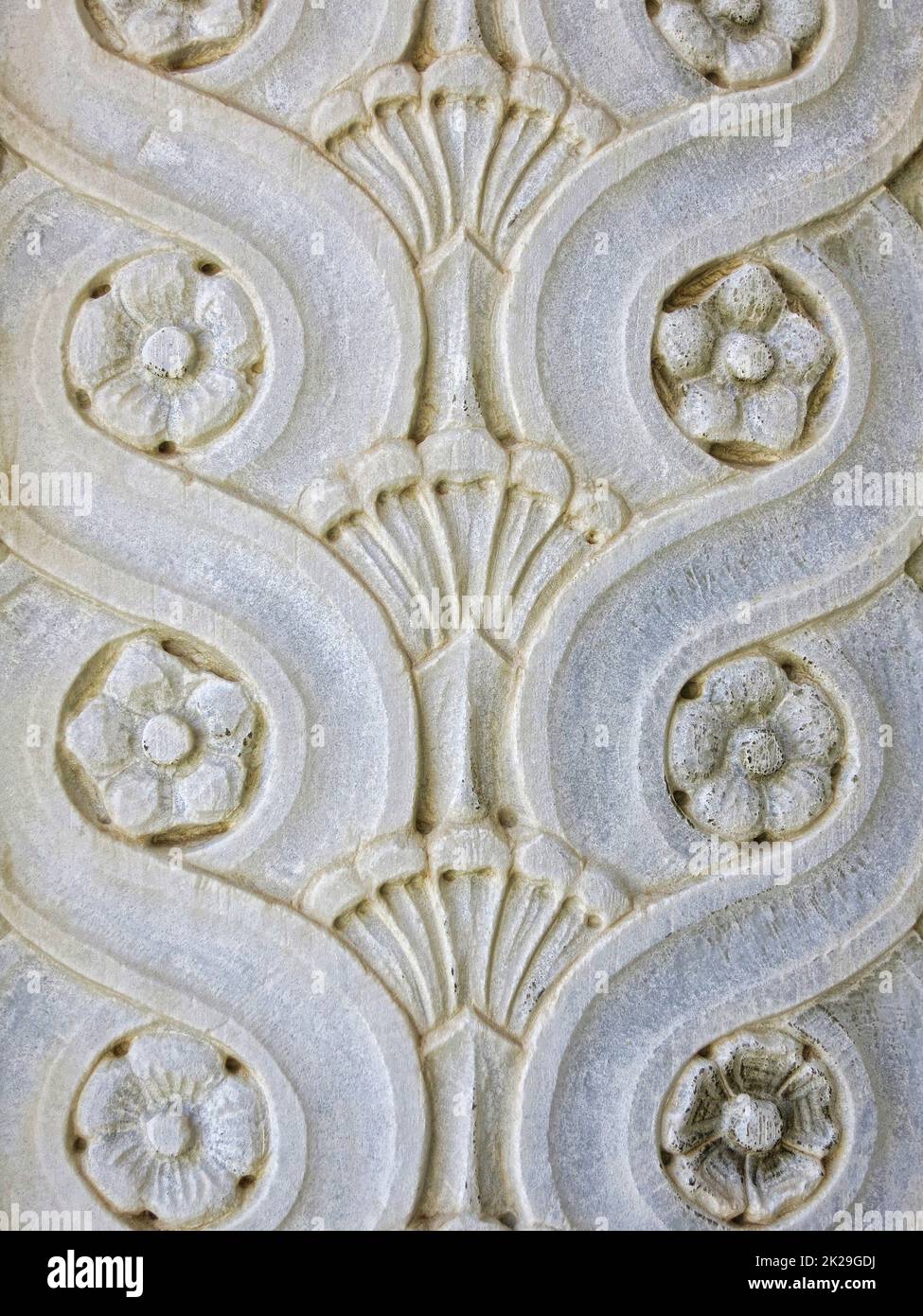 Bas relief with a floral motif in white marble Stock Photo - Alamy