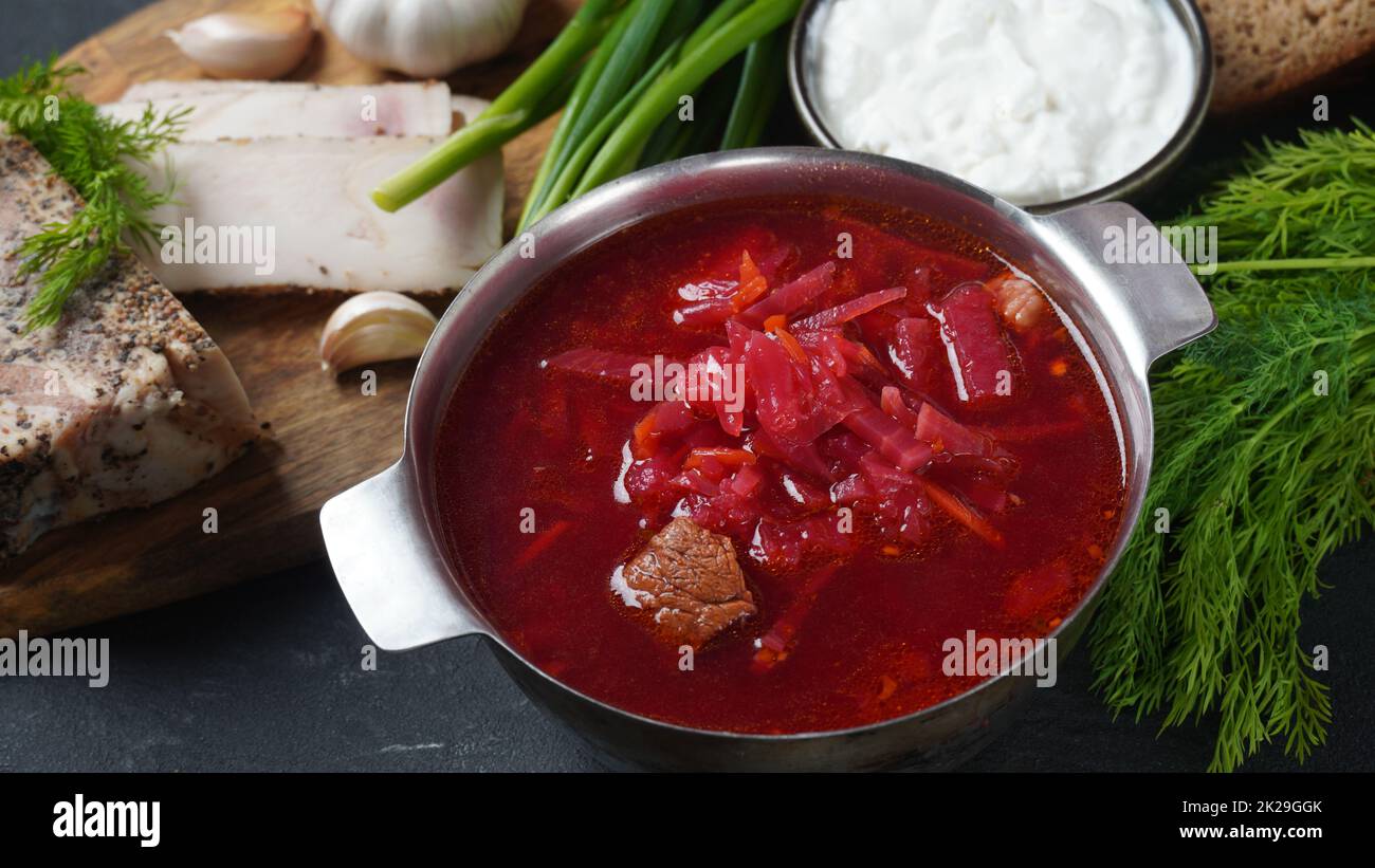 Traditional Ukrainian Russian borscht . Bowl of red beet root soup borsch with white cream ...