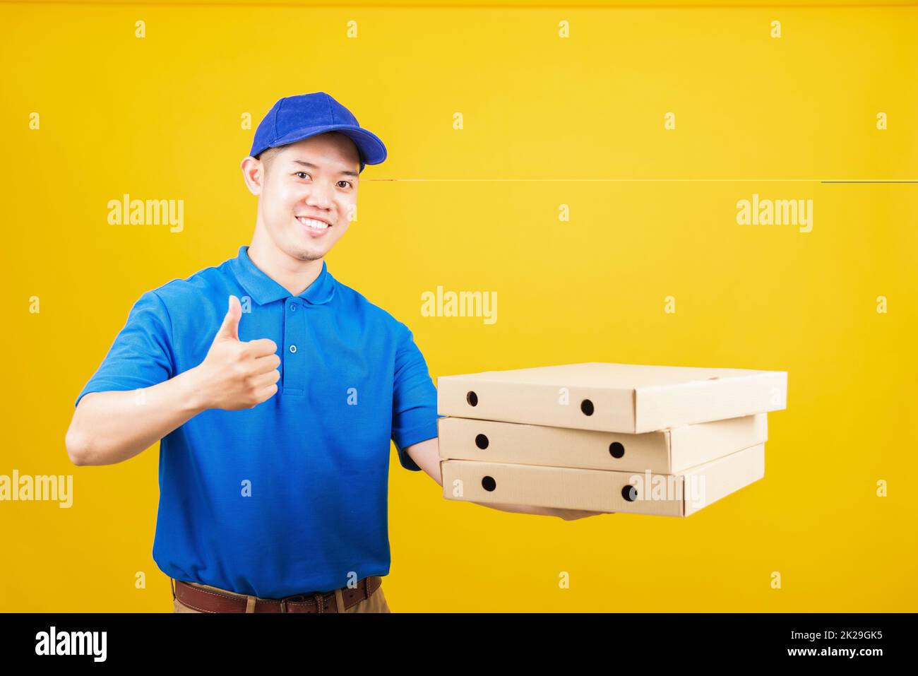 delivery service man standing he smile wearing blue t-shirt uniform ...