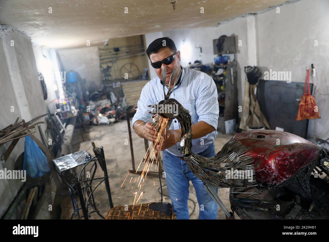 Giza, Egypt. 3rd Sep, 2022. Egyptian sculptor Ammar Shiha makes an ...