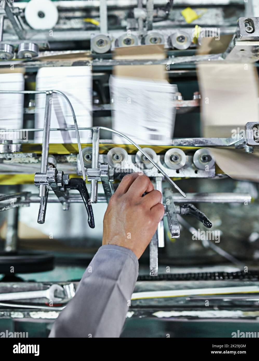 Printing and packaging under one roof. Detail shot of the workings of a ...