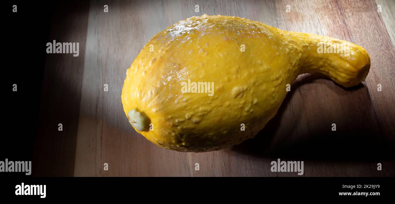 Yellow squash on a butcher block with copy space Stock Photo - Alamy