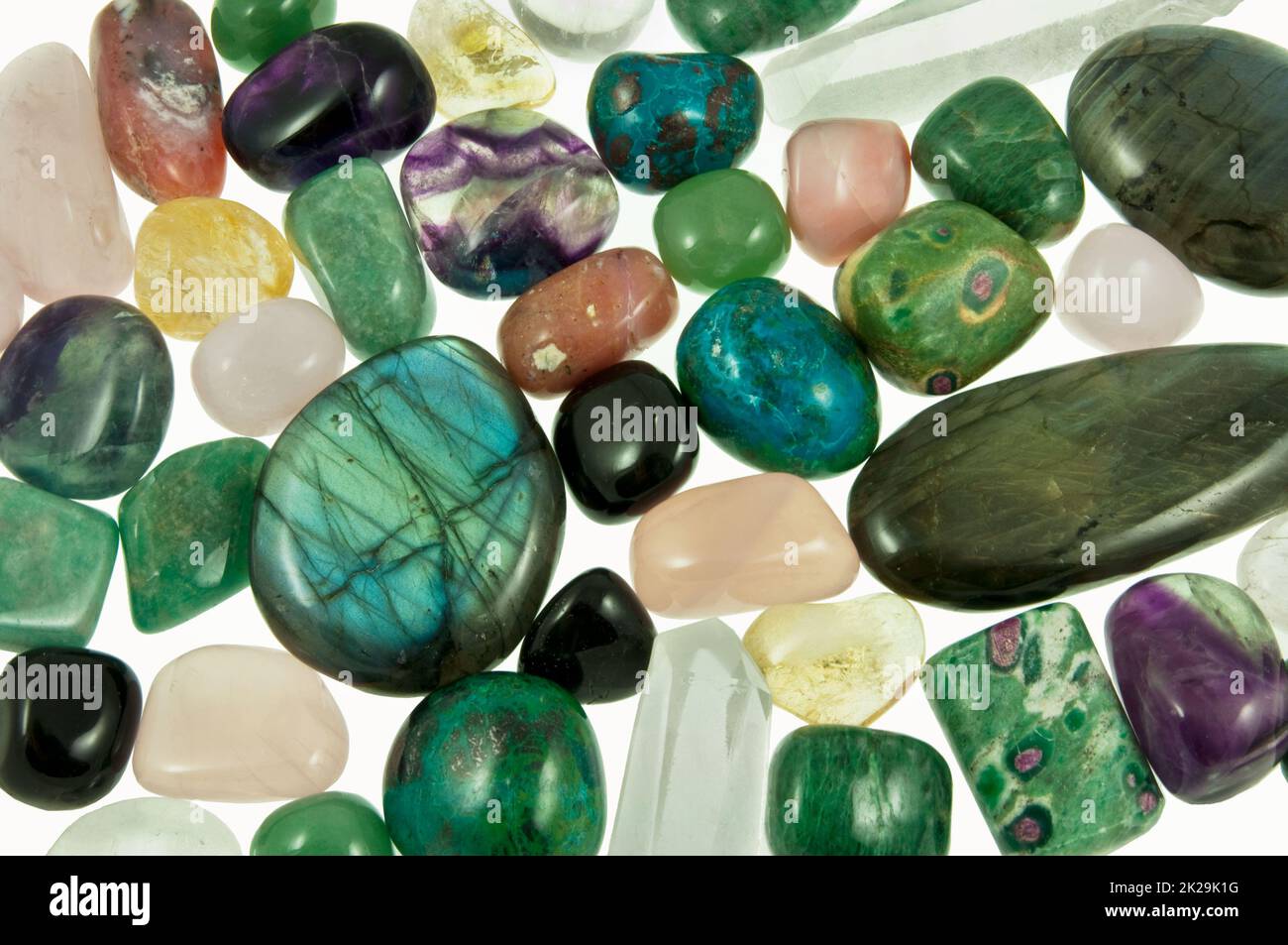 Closeup of different tumbled gemstones on white background Stock Photo ...