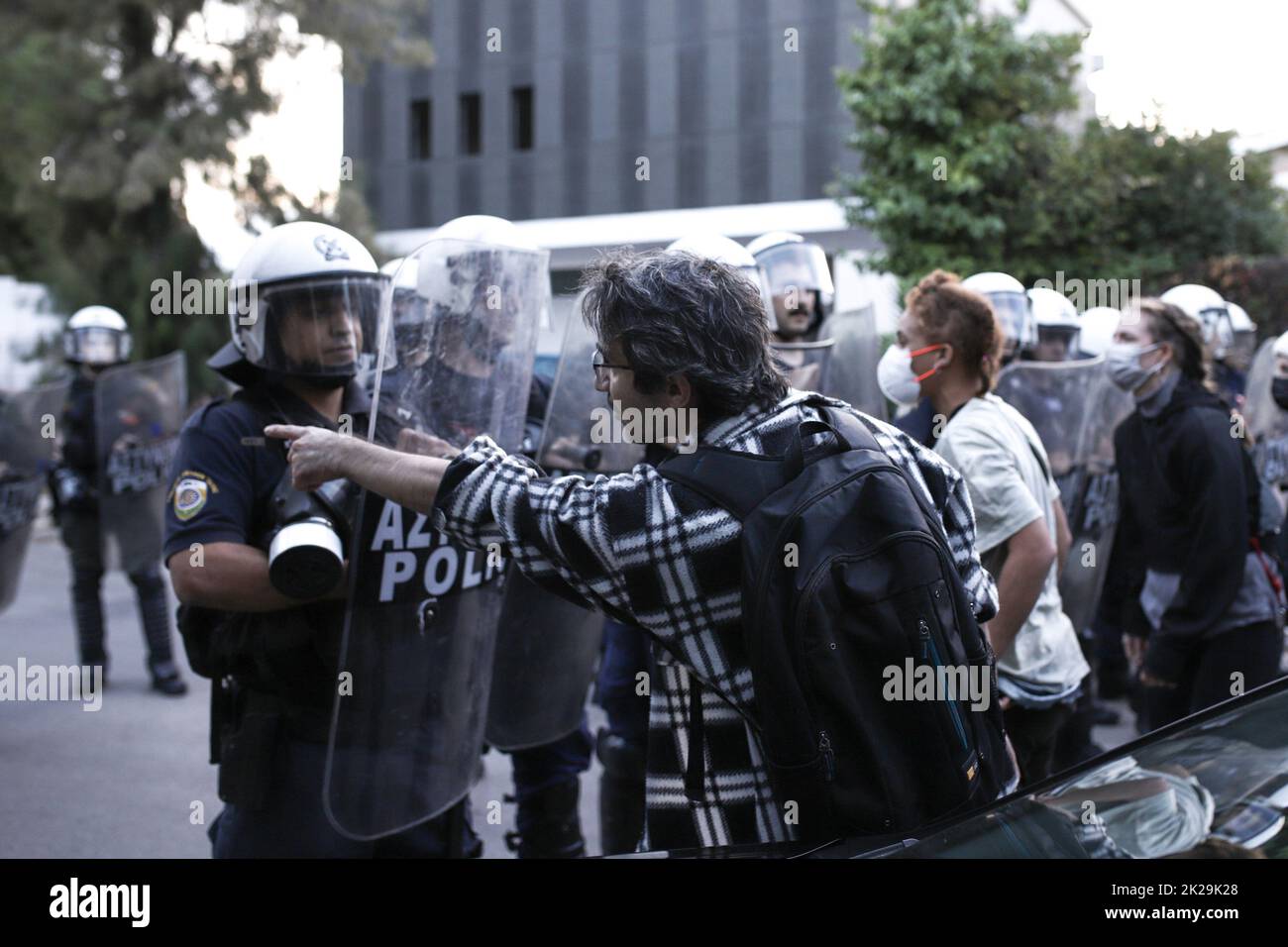 A man yells at the riot police in front of the Iranian Embassy of ...