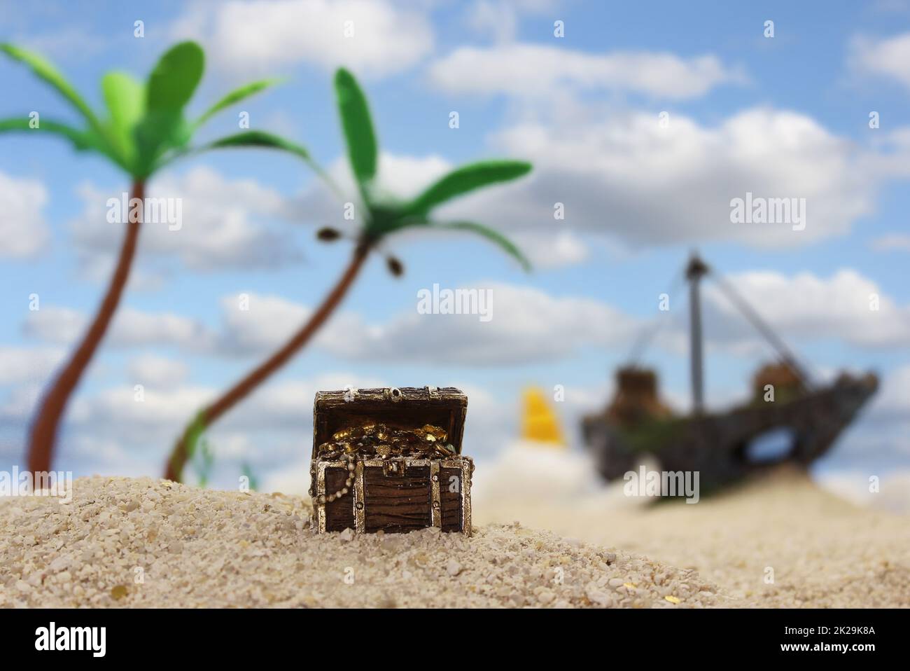 Pirate Treasure and Old Ship on Beach With Blue Sky Stock Photo - Alamy